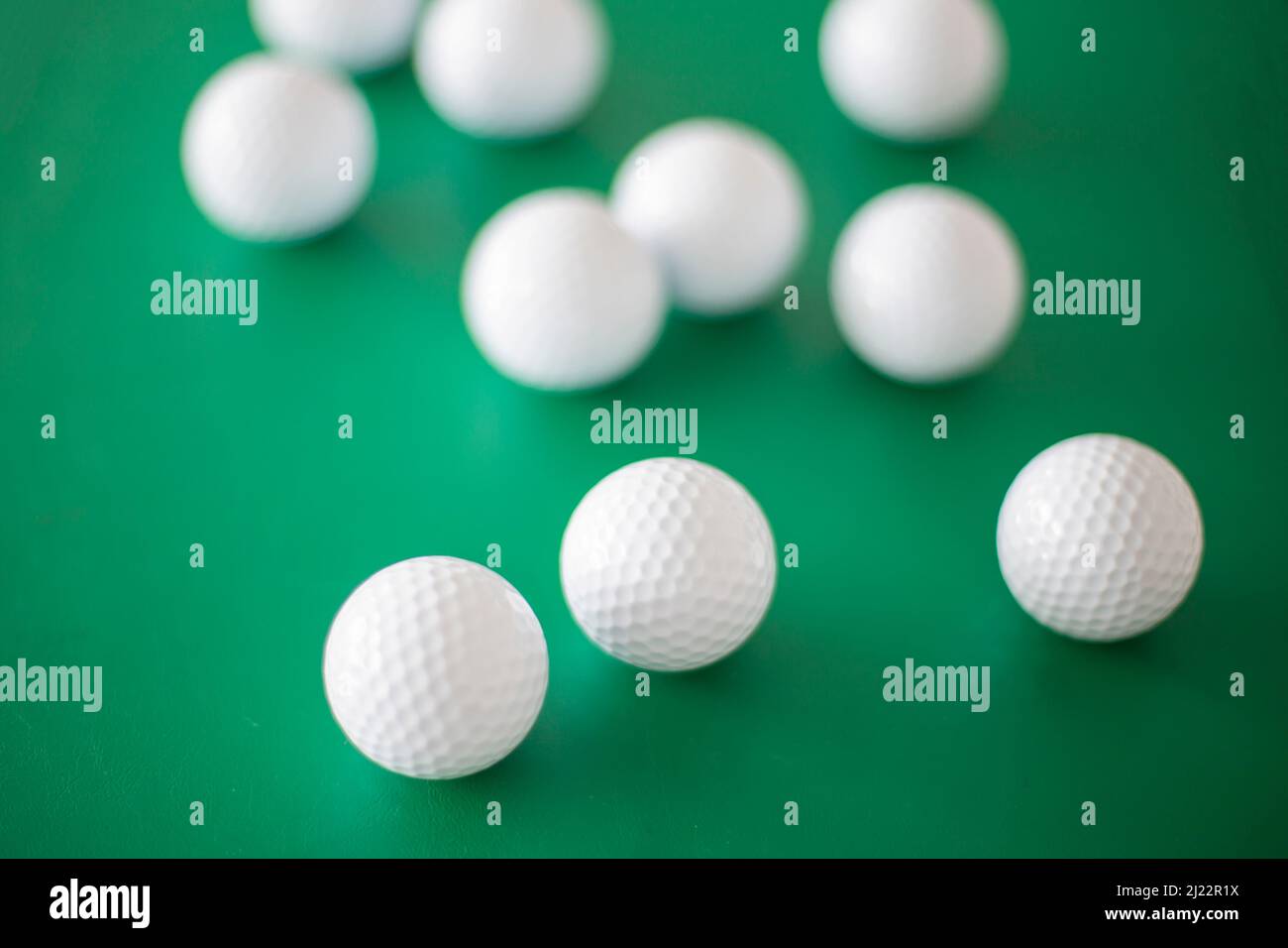 Group of golf balls on the green background Stock Photo - Alamy