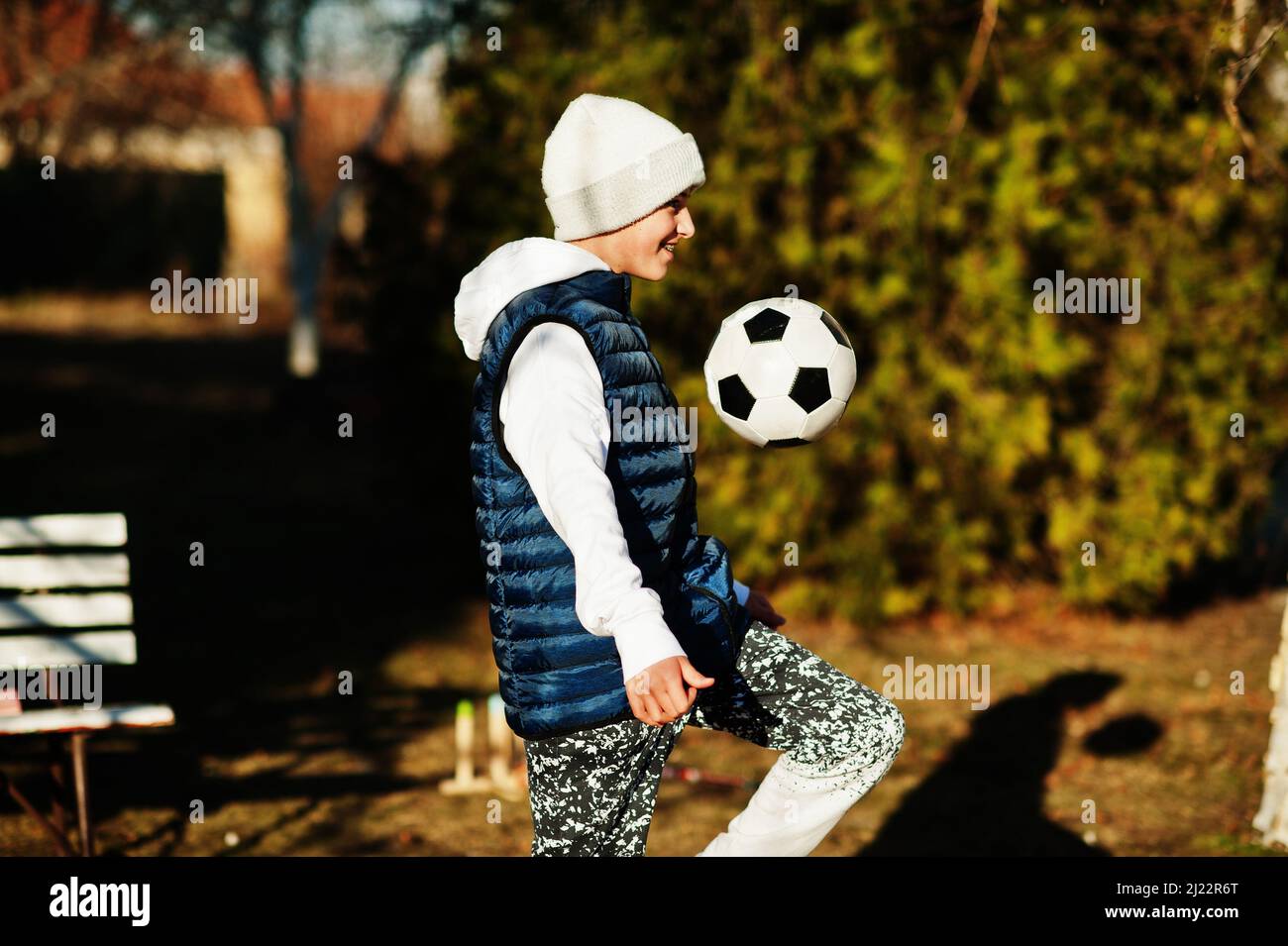 Boy play with the soccer ball in spring sunny day Stock Photo - Alamy