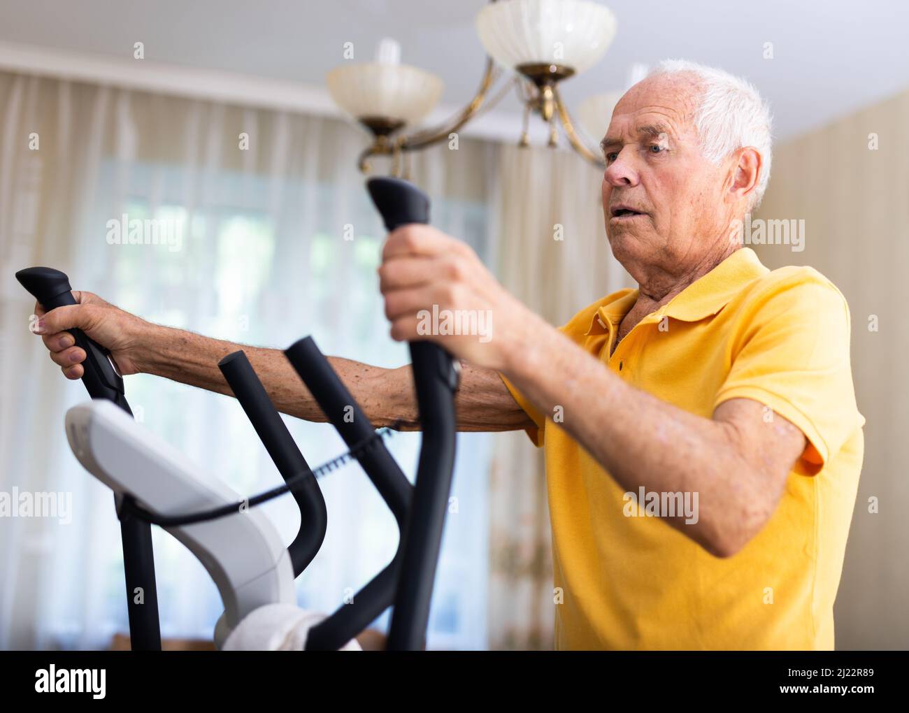 Senior exercise at home machine hi-res stock photography and images - Alamy