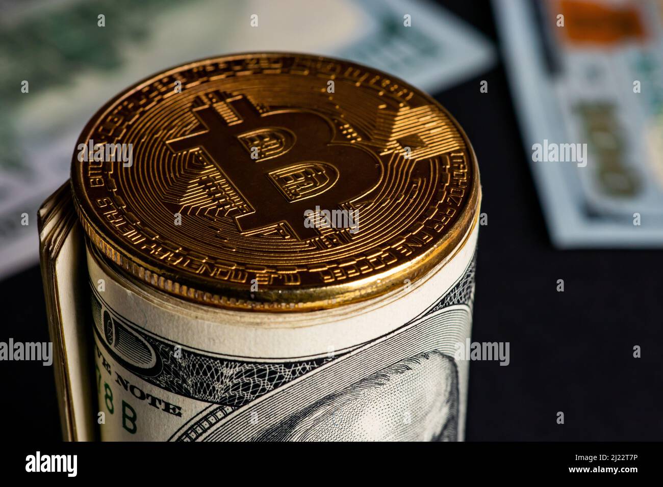 Golden Bitcoins on US dollars. Electronic money exchange concept Stock ...