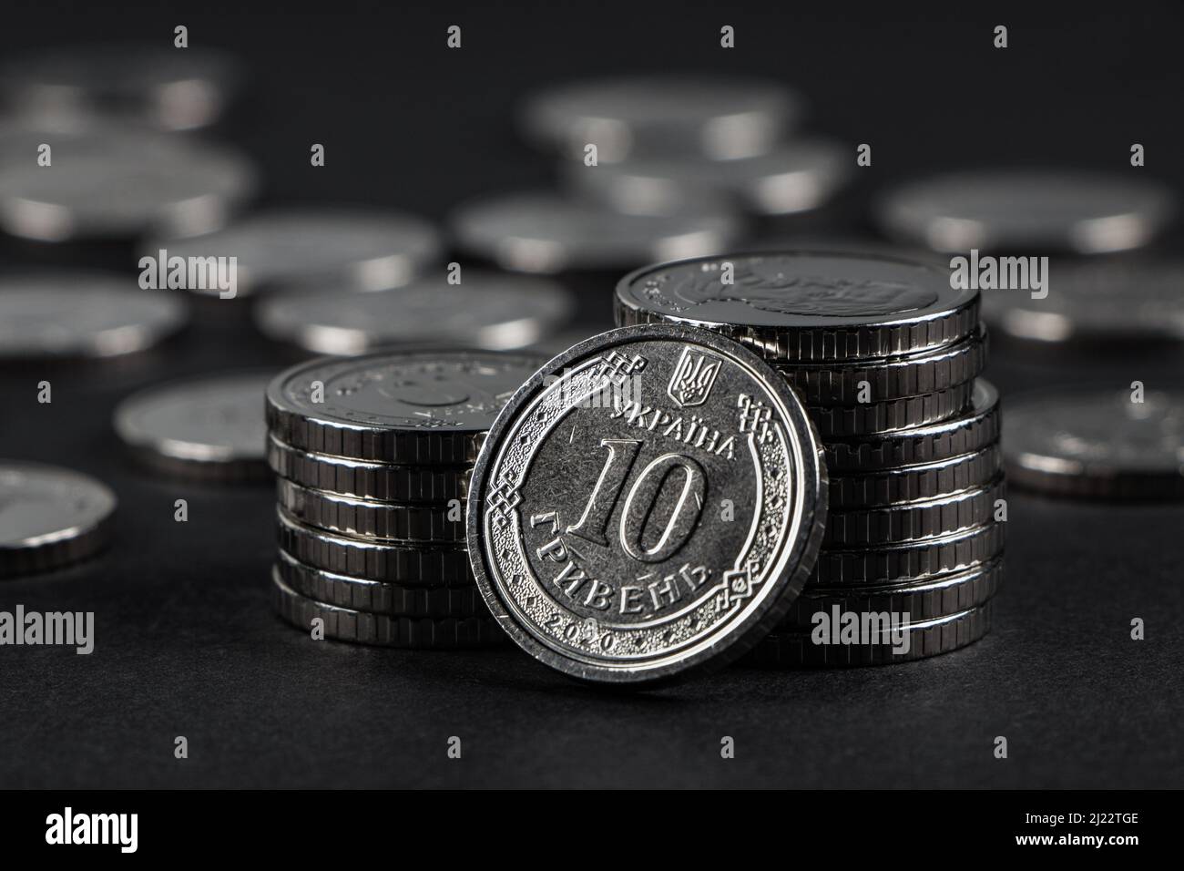 Silver coins on dark background. Ukrainian 10 hryvnias coins. Money and ...