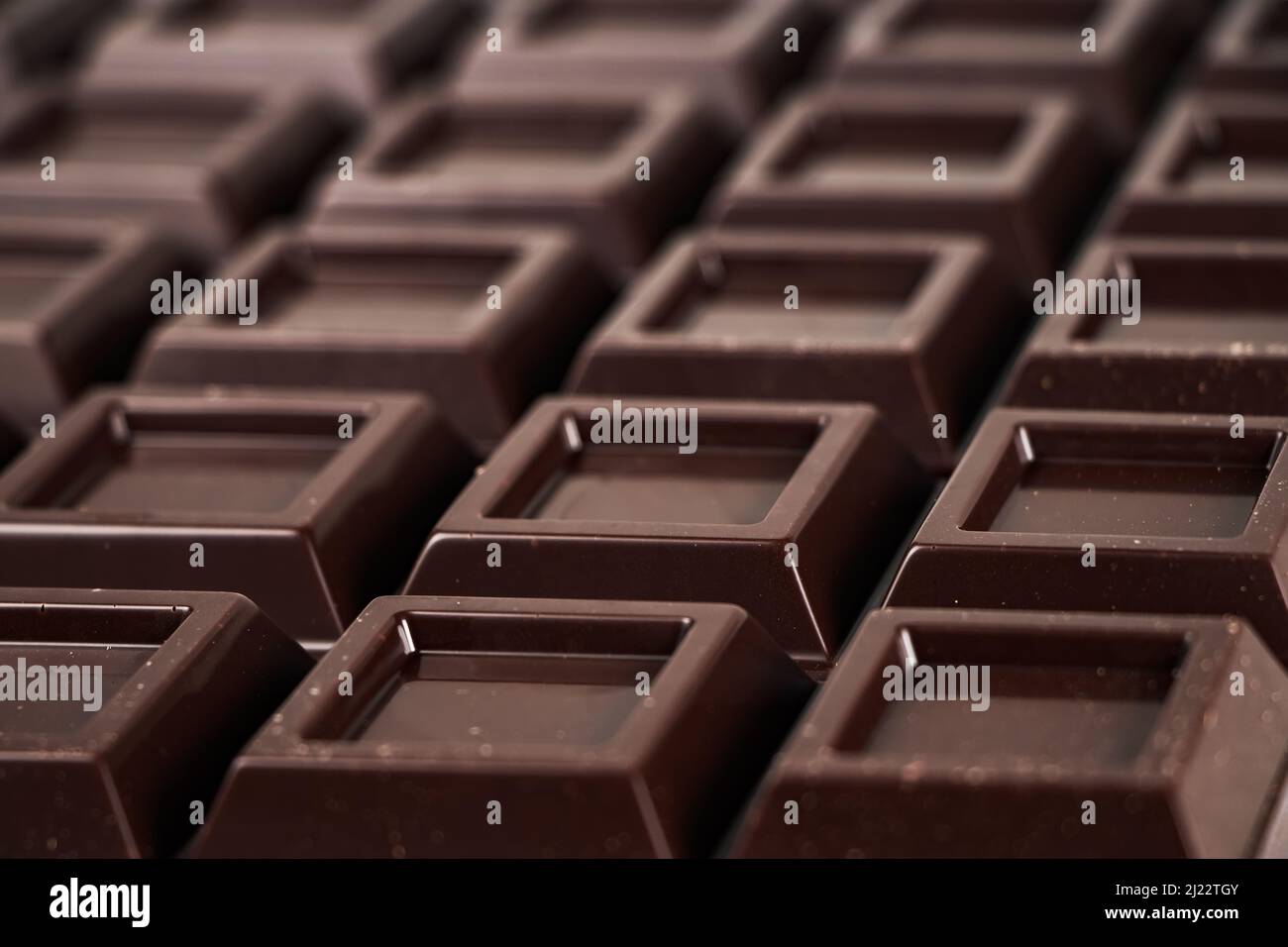 Close up a chocolate bar background. Chocolate bar cubes macro Stock ...