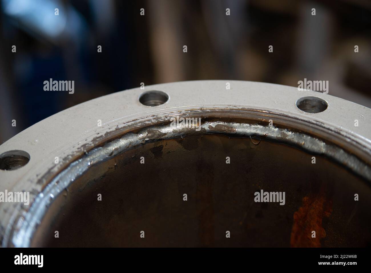Close up stainless steel weld between pipe and flange Stock Photo - Alamy