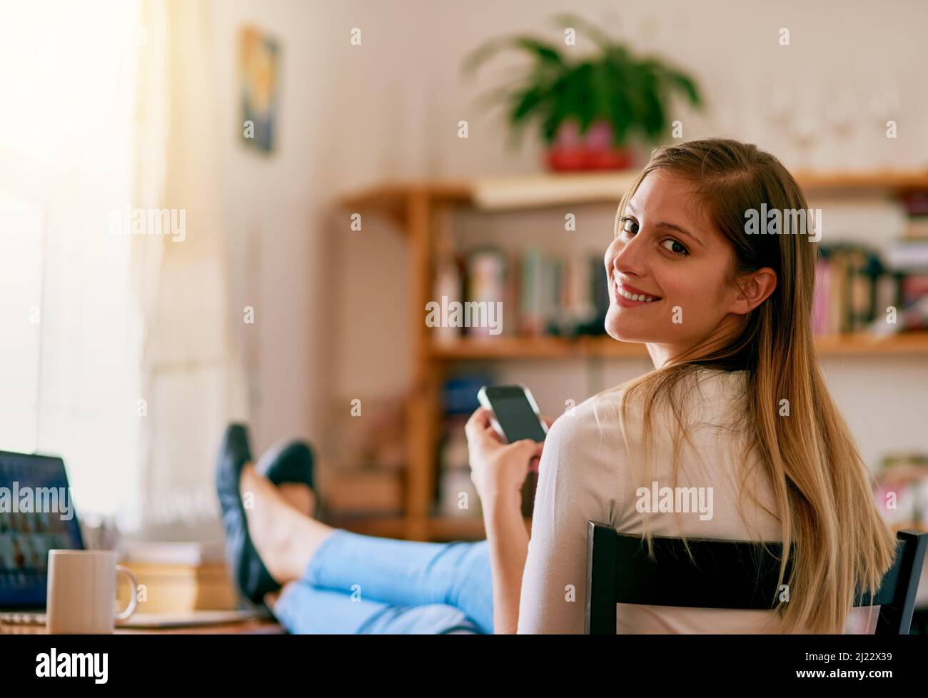 I cant imagine my life without wifi. Portrait of a young woman using ...