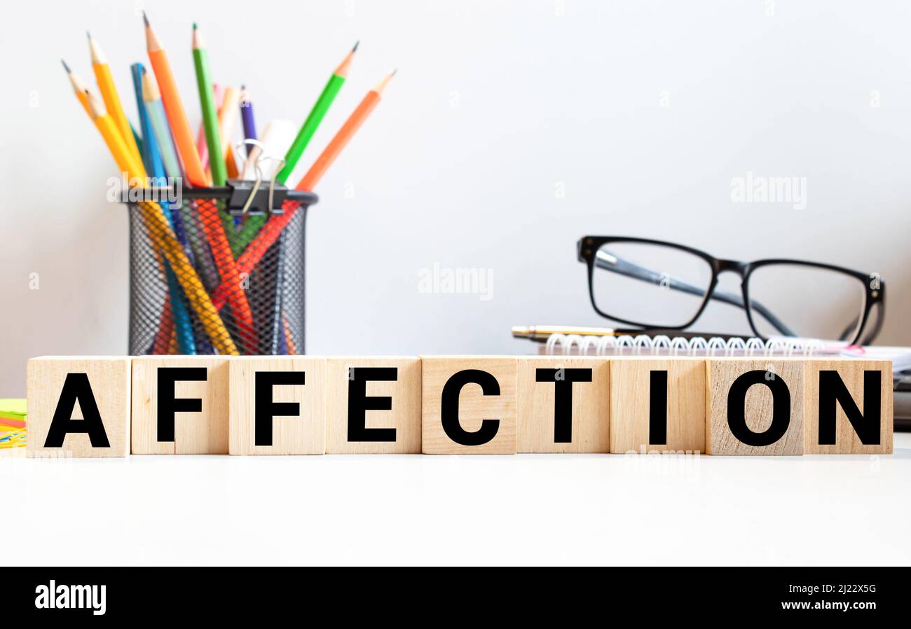 Affection text on wooden block on black texture background Stock Photo ...