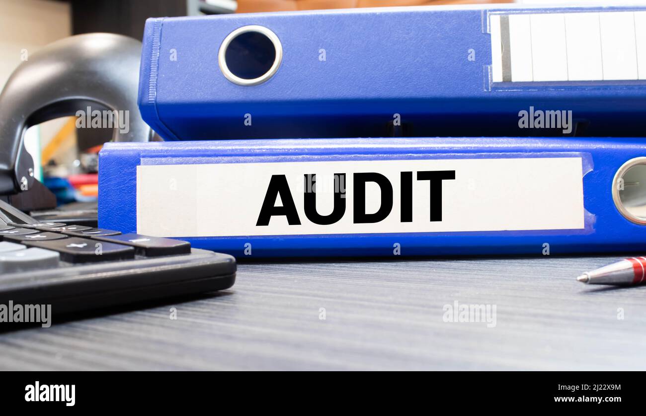Folder with the label Audit, business concept Stock Photo - Alamy