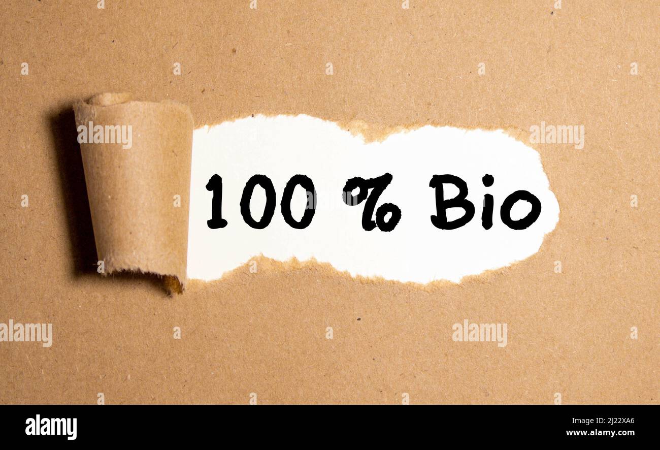 100 percent Bio write on torn paper, concept Stock Photo - Alamy