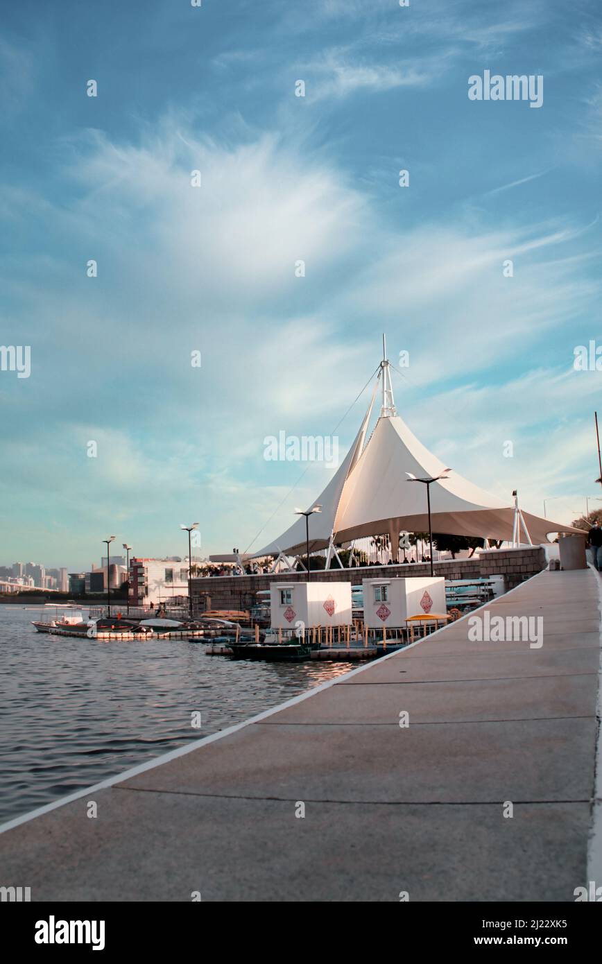 A vertical scenic view of the Nam Van Lake Nautical Centre against blue ...
