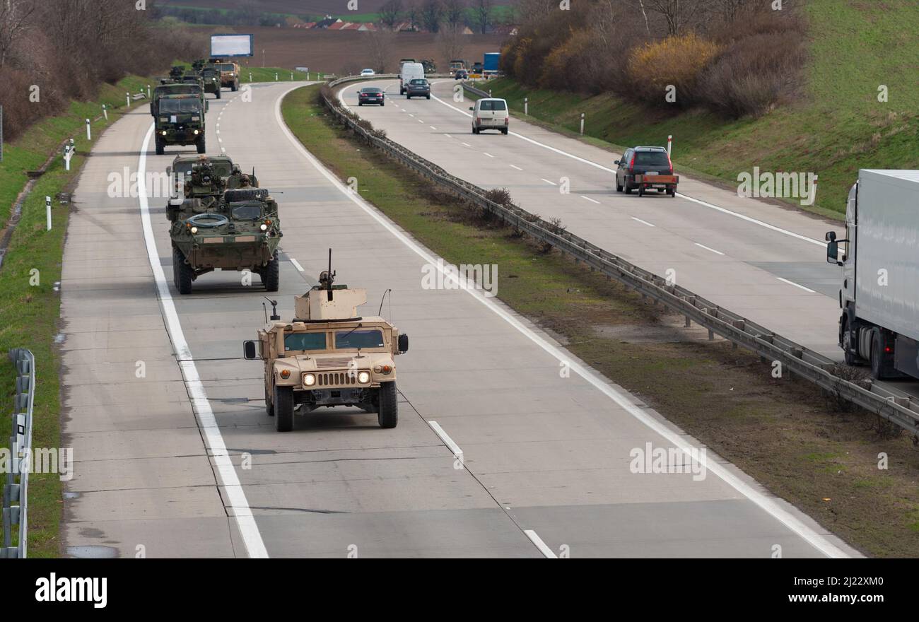 US army military convoy passes in Czech Republic. Strykers, humvee ...