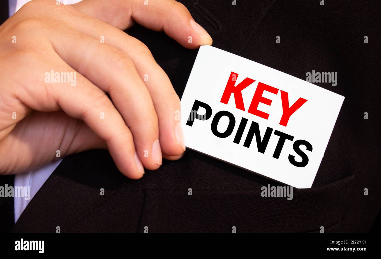 Bussinessman putting a card with text KEY POINTS in the pocket Stock ...