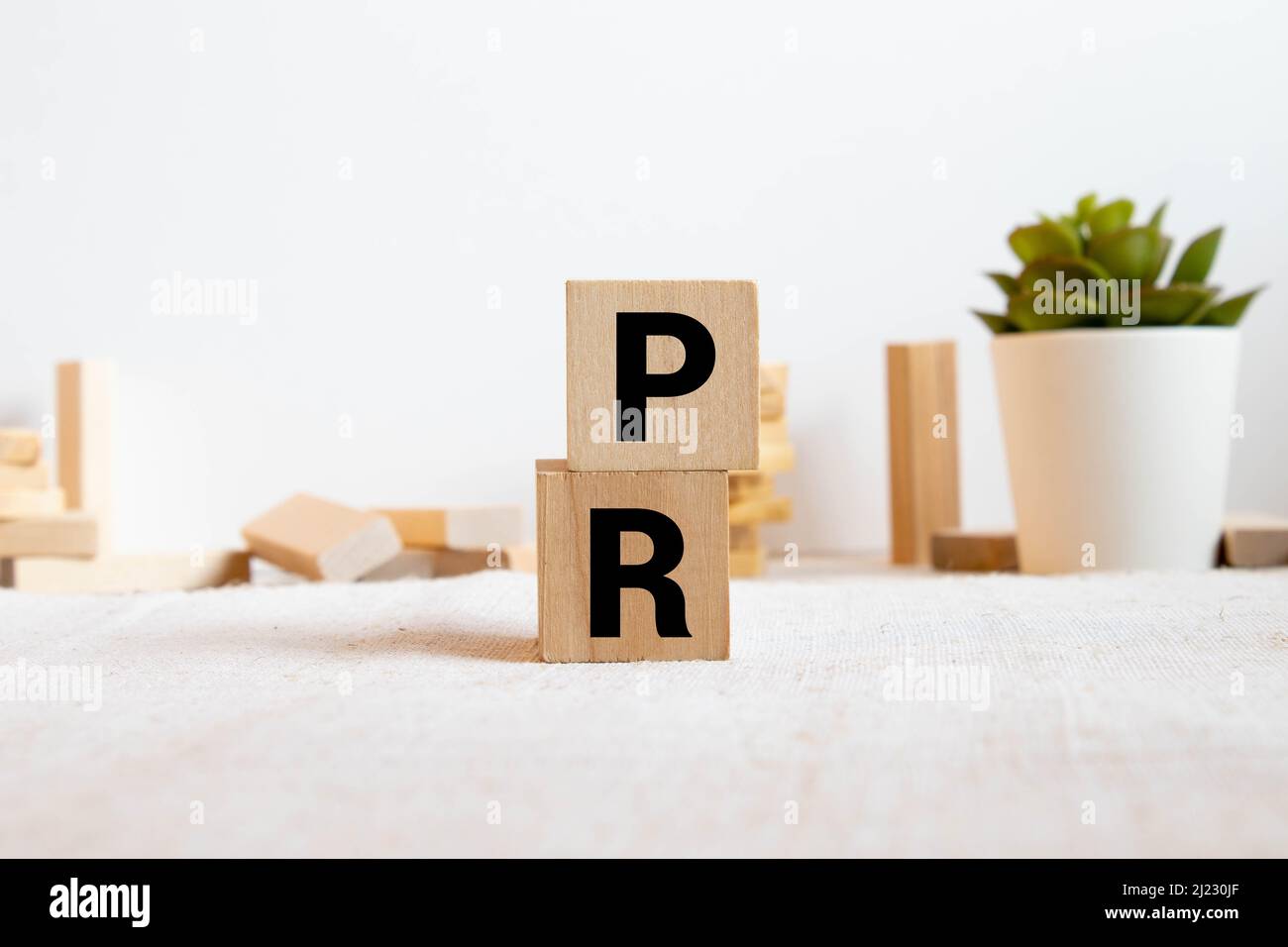 PR word background on wood blocks concept Stock Photo - Alamy