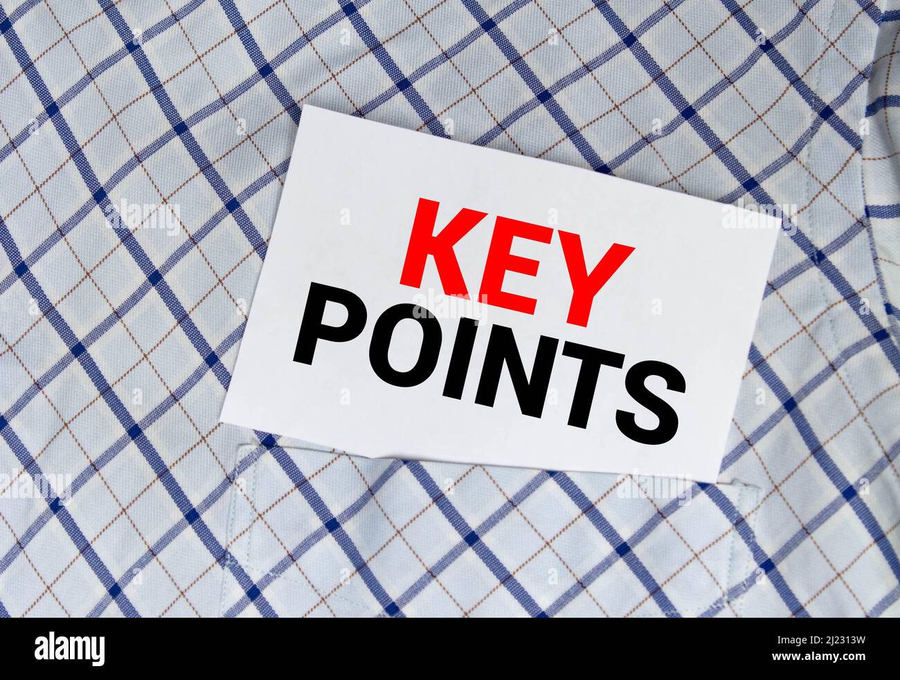 Closeup on businessman holding a card with text KEY POINTS, business ...