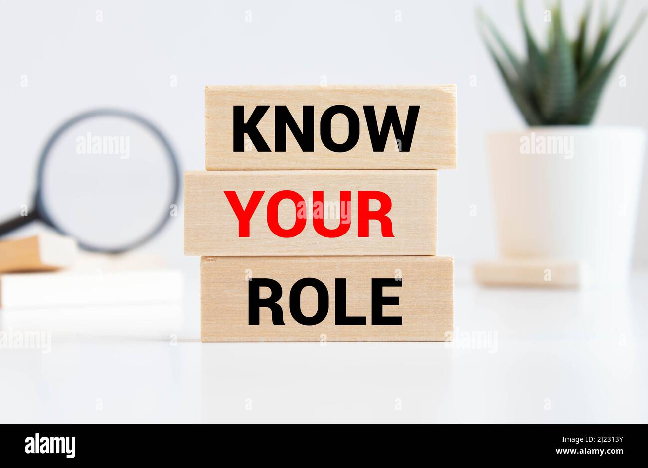 KNOW YOUR ROLE text on a wooden cubes on a wooden background with cofee ...