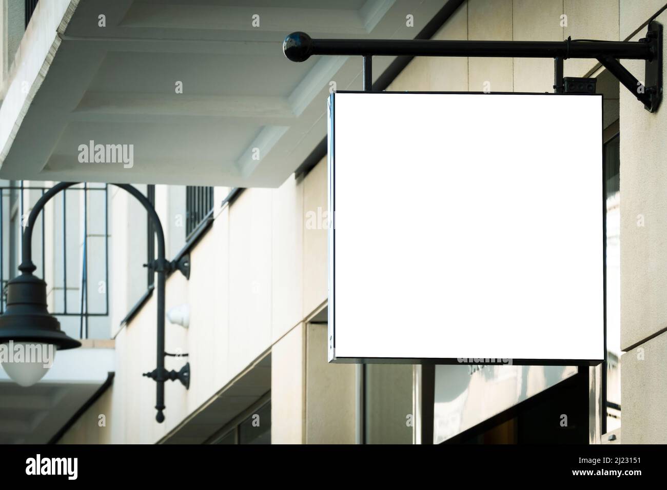 Mock up. Empty white rectangular signage on the wall of classical ...