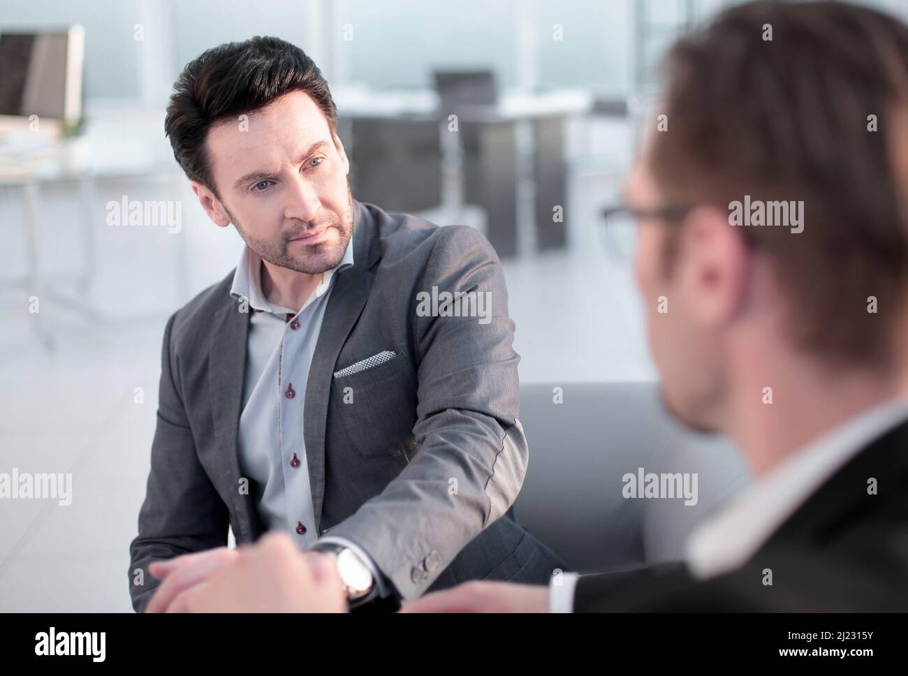 close up.business partners discussing common interests Stock Photo - Alamy