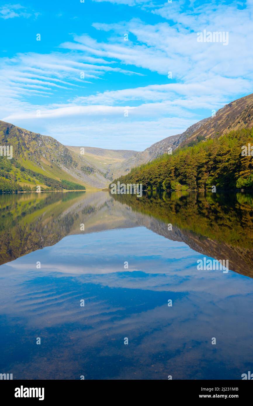 A beautiful view of a lake surrounded by cliffs in Dublin, Republic of ...