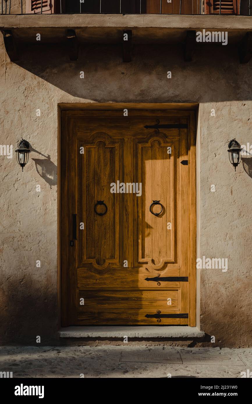 Yellow door in old house with sunset light Stock Photo - Alamy