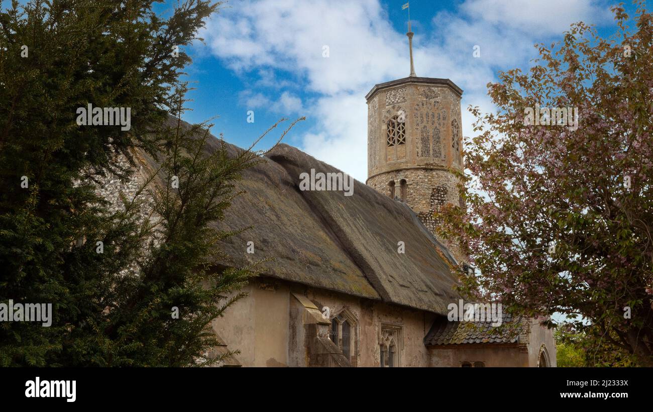 St Mary the Virgin Church, with octagonal tower and thatched roof at ...