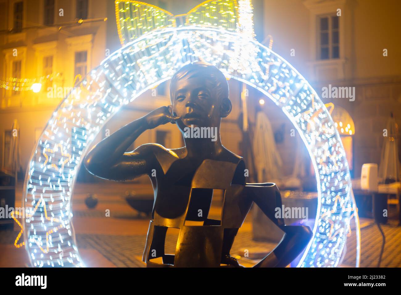 Modern art sculpture representing a boy talking on the mobile phone ...