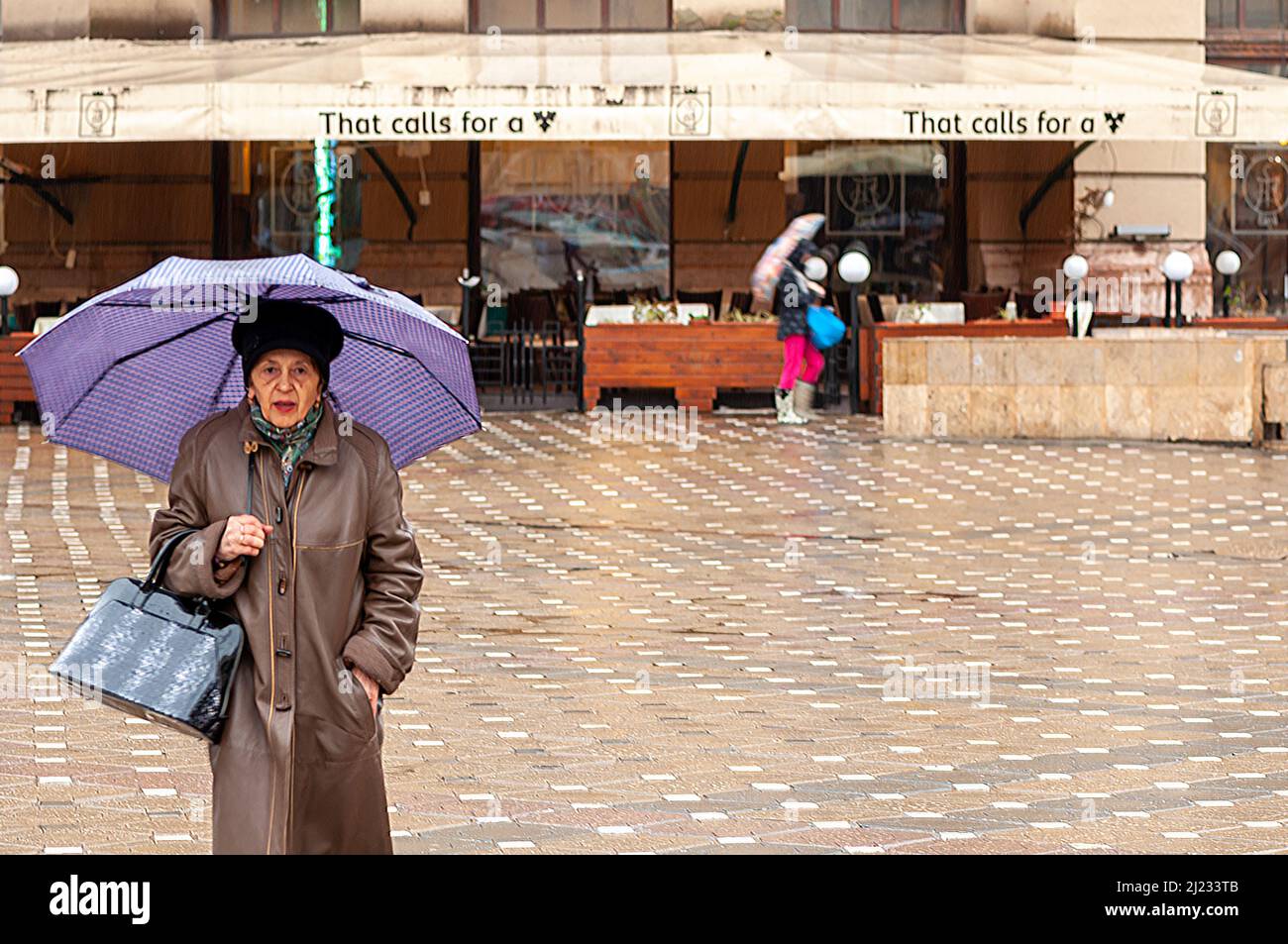Timisoara, Romania - March 23, 2016: Woman walking on the street in the ...