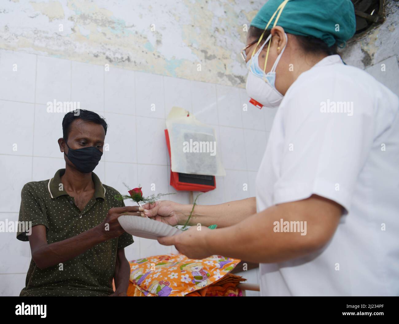 Doctors and Nurses giving roses to the TB (Tuberculosis) patients with ...