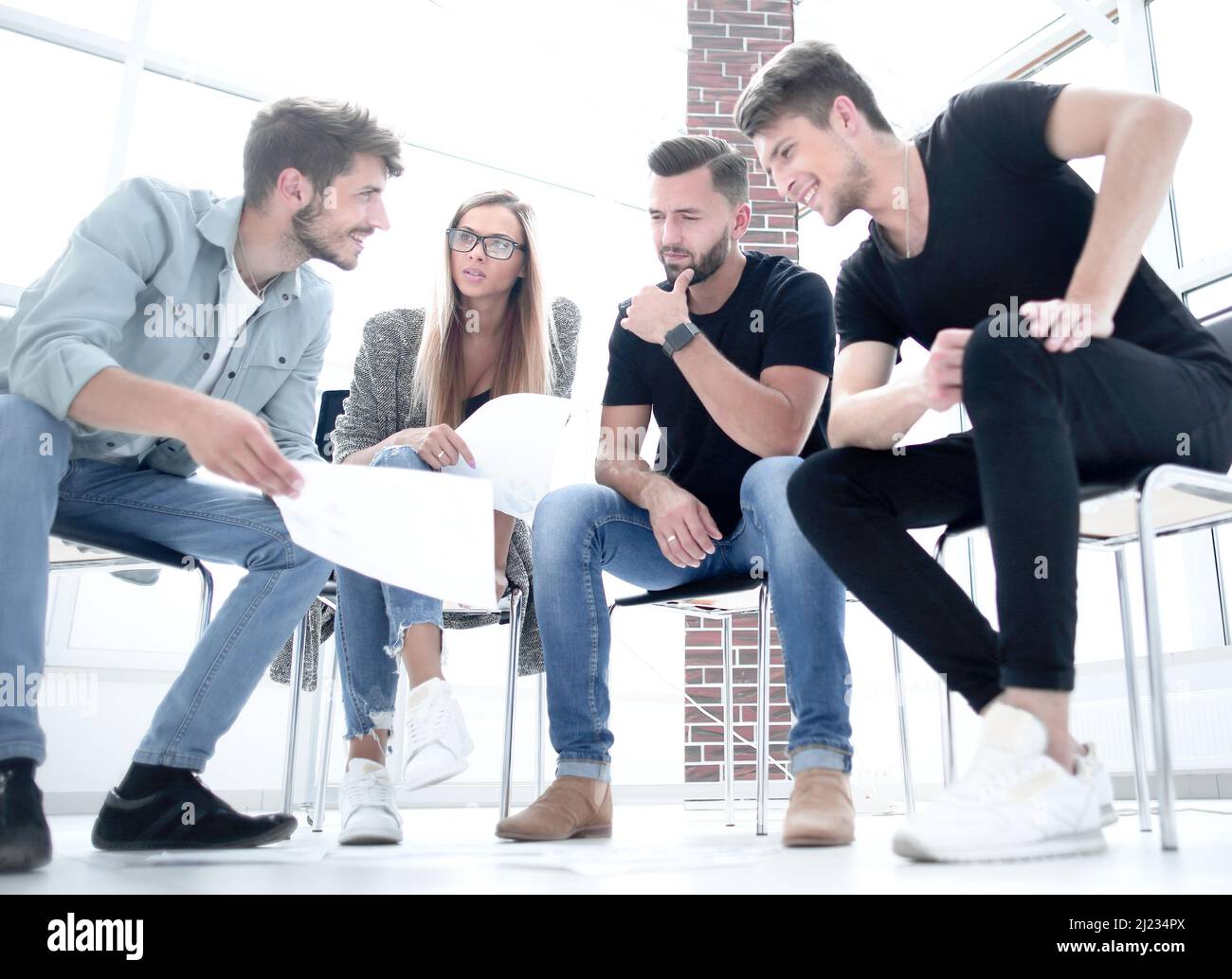 Business man passing over documents to leader during meeting Stock ...