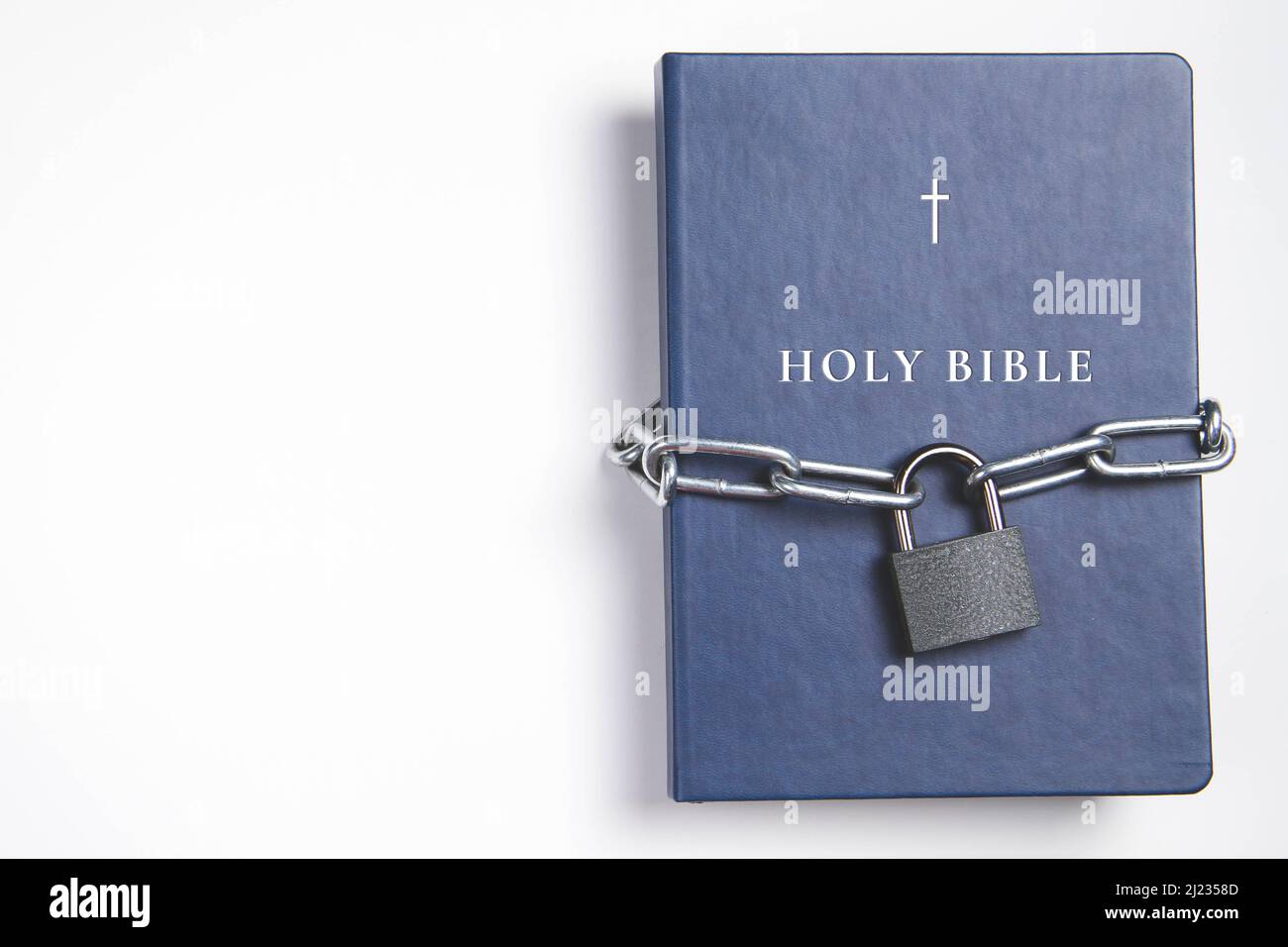 Bible. Book with lock. A closed book is banned. Chain and padlock ...