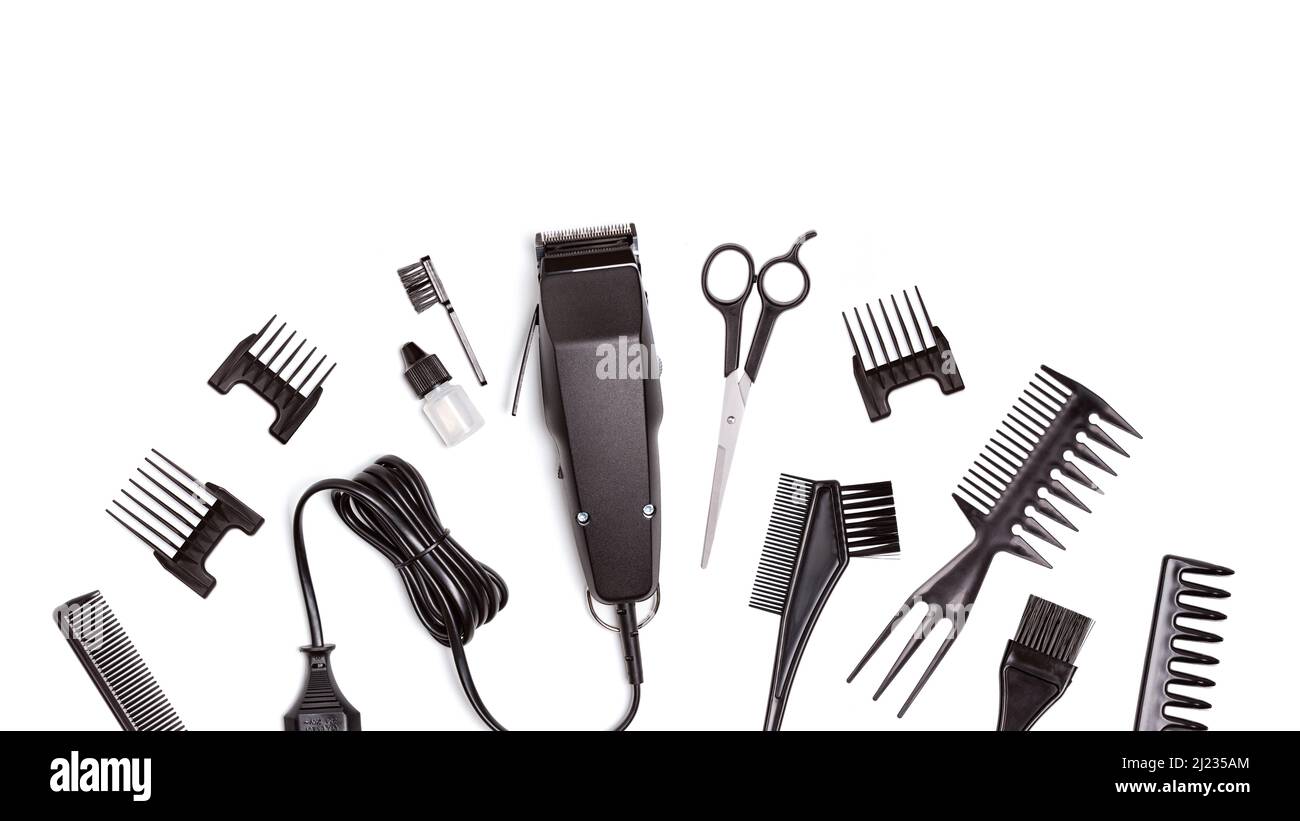 Professional hair clipper with set of nozzles of different sizes ...