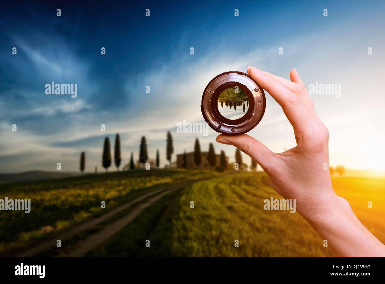 Hand holds lens viewfinder against nature in Tuscany Stock Photo - Alamy