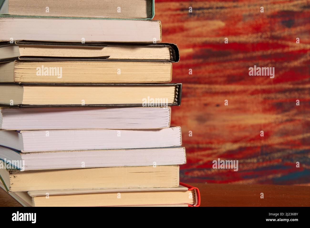 Close-up of background stack of old used books. Pile of vintage old ...