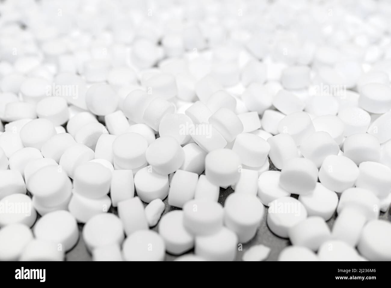 Background made of salt tablets for a water softener, large round cubes ...