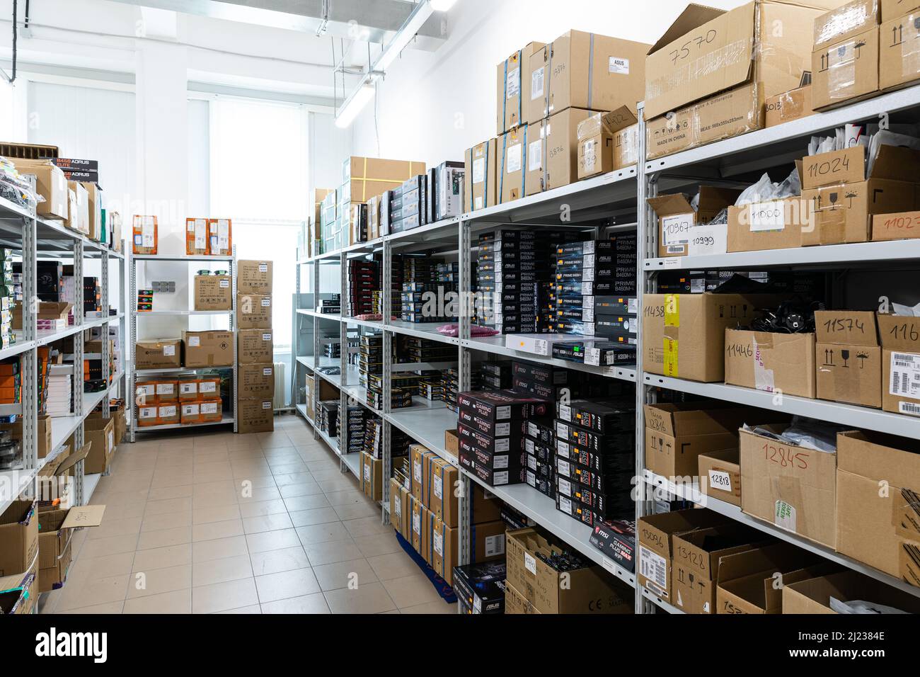 Photo of a warehouse with boxes on the shelves. Utility room of a ...