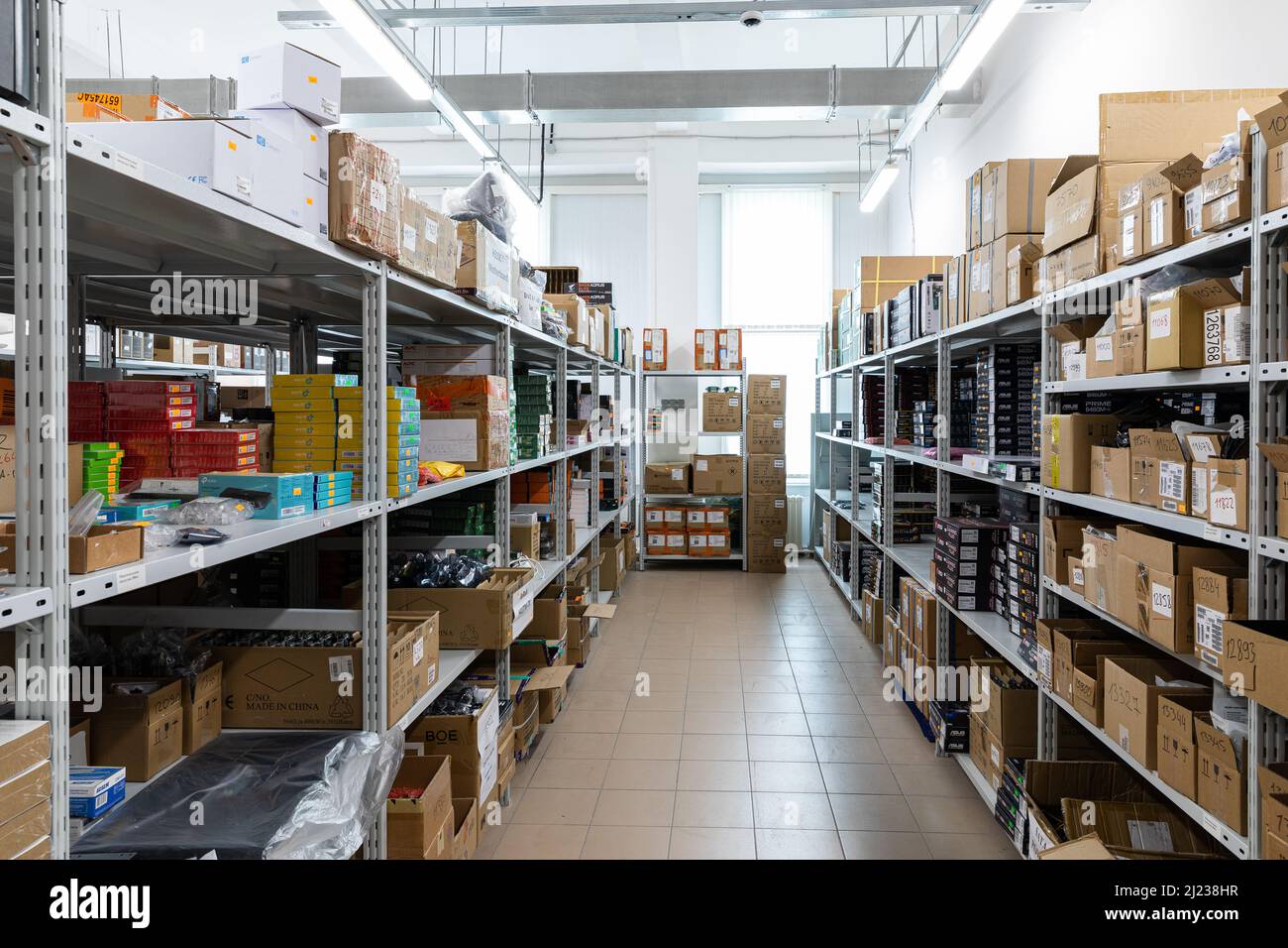 Photo of a warehouse with boxes on the shelves. Utility room of a ...