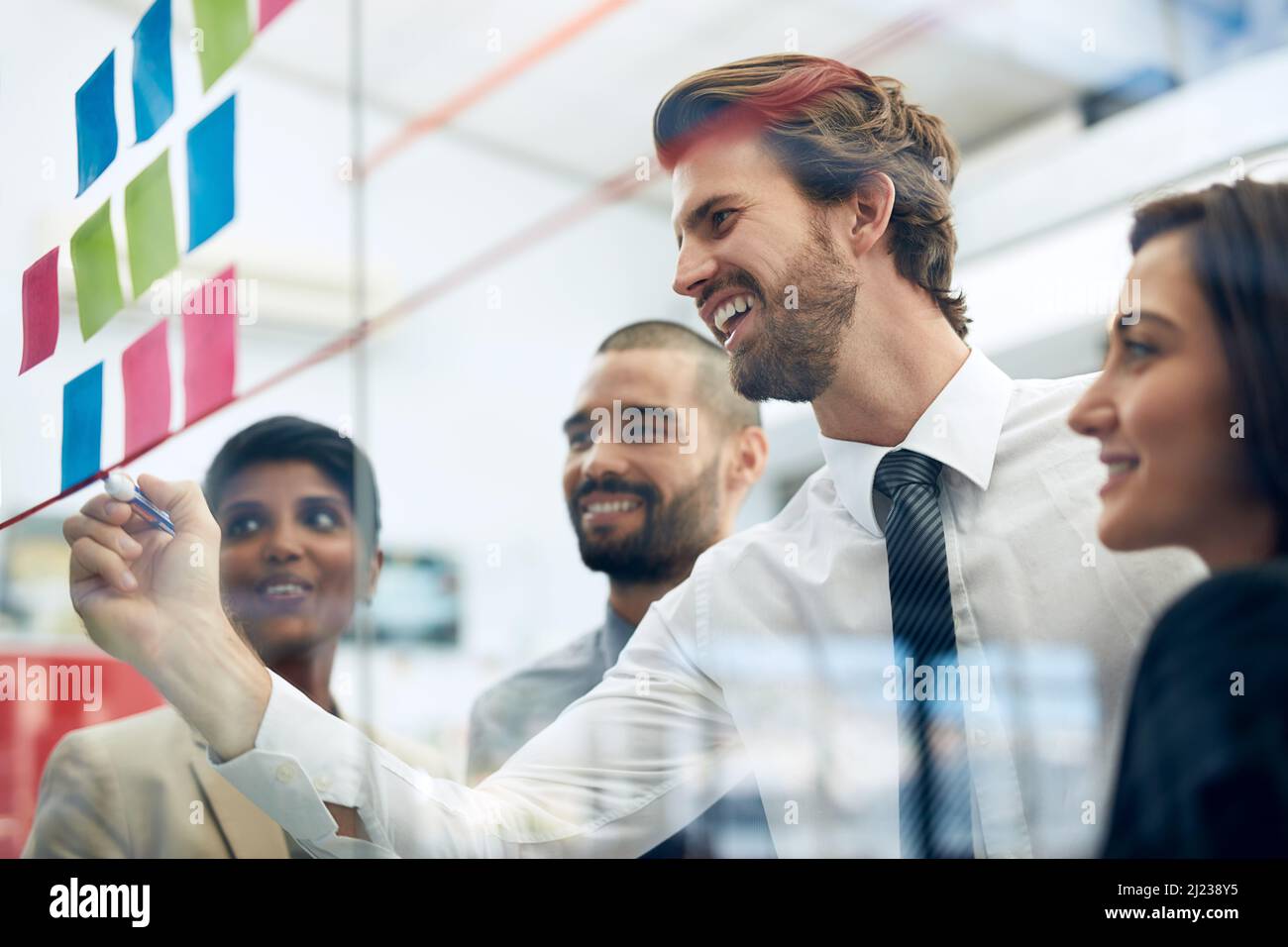 Businessman businesswoman working together drawing hi-res stock ...