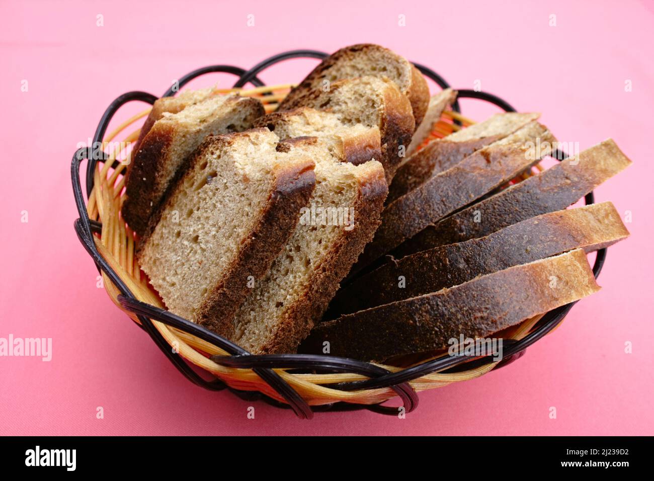 Plateful of bread on a red background Stock Photo - Alamy