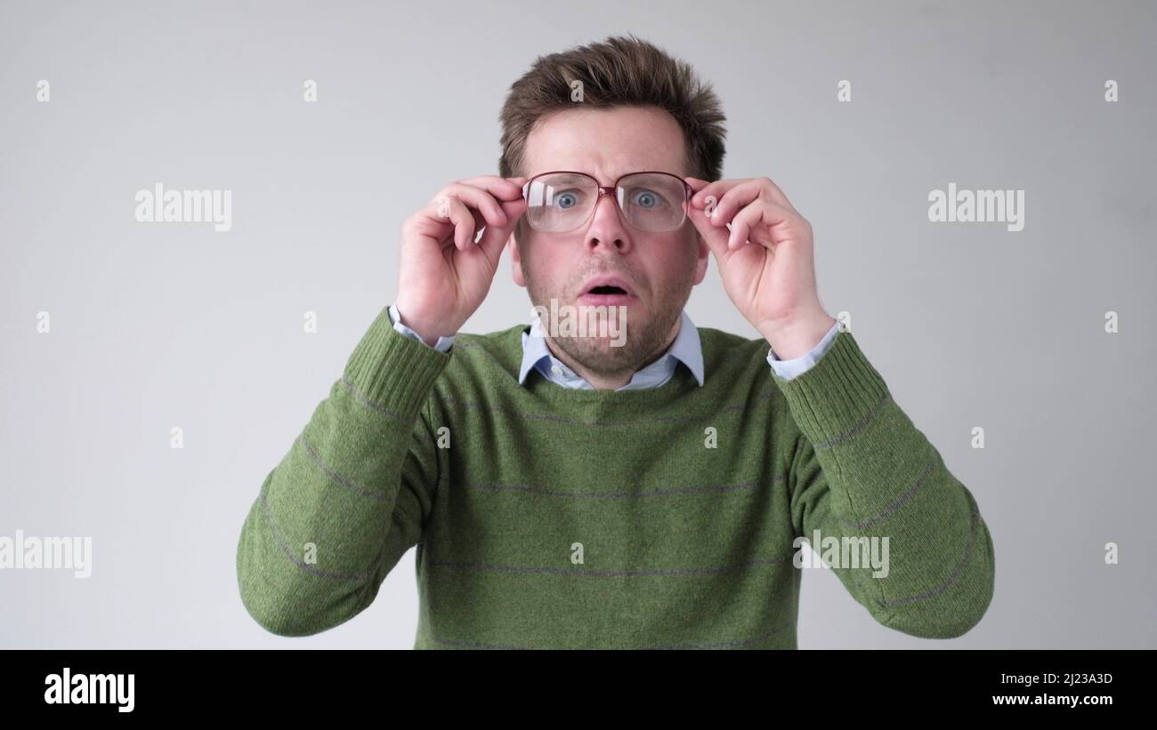 Handsome caucasian young man with wide eyes and mouth open in surprise ...