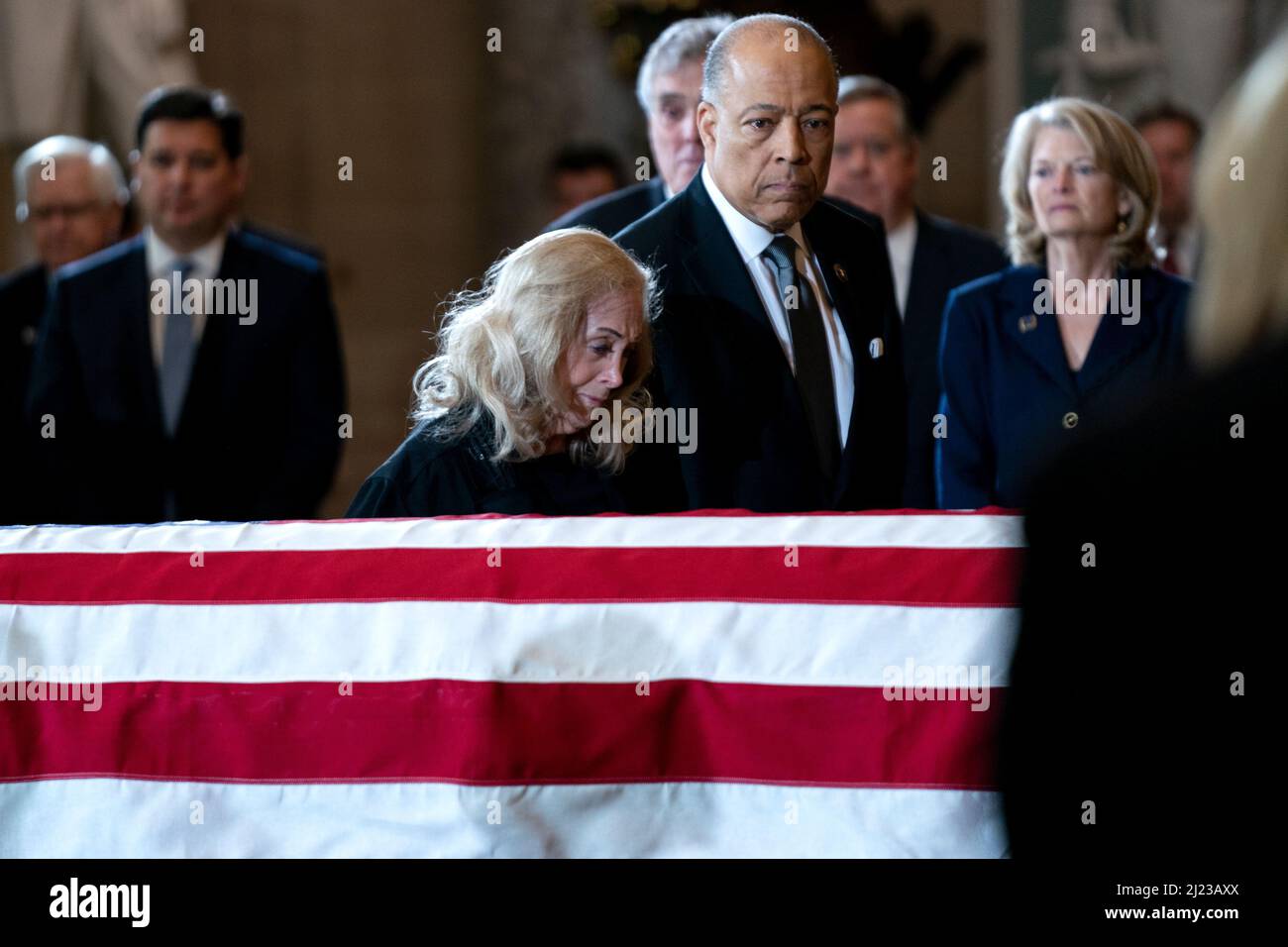 Washington, USA. 29th Mar, 2022. Anne Garland Walton is accompanied by ...