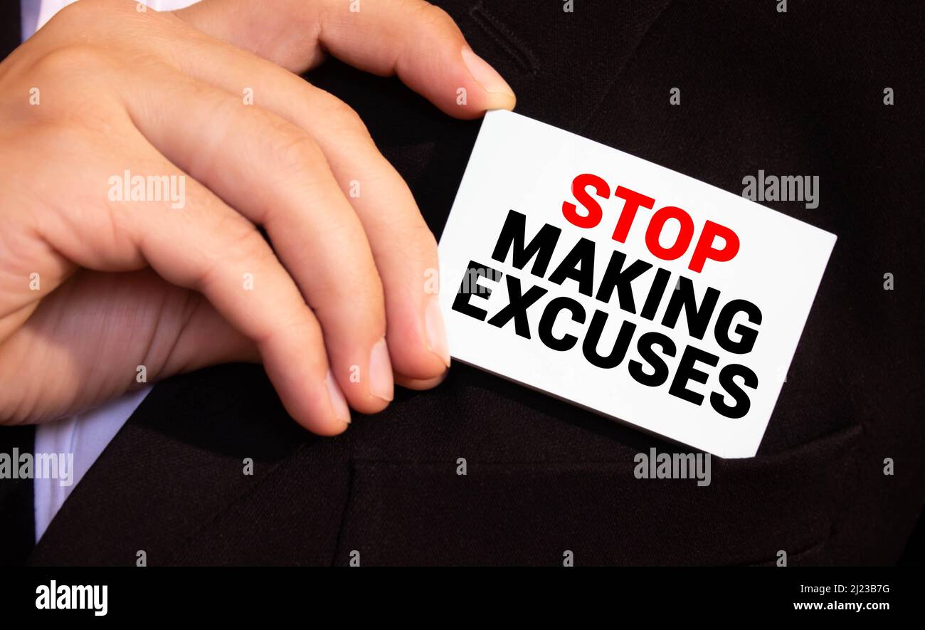 STOP MAKING EXCUSES, message on the card shown by a man Stock Photo - Alamy