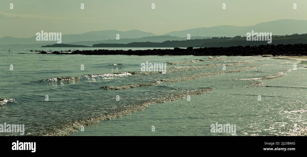 rocky promontories near Moelfre Dulas Bay on Isle of Anglesey, Ynys Mon ...
