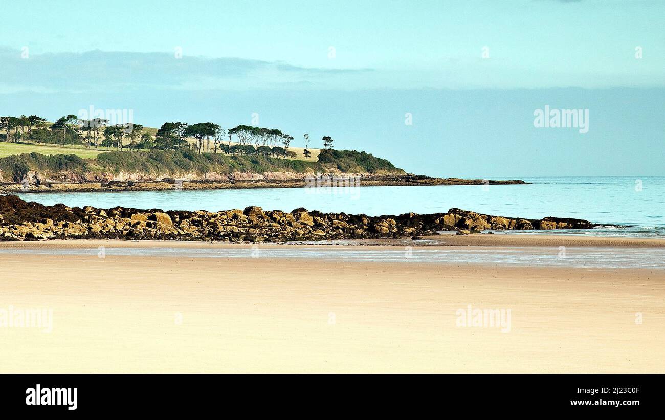 Blue Sky over Dulas Bay beach and sea view from coastal path out of ...