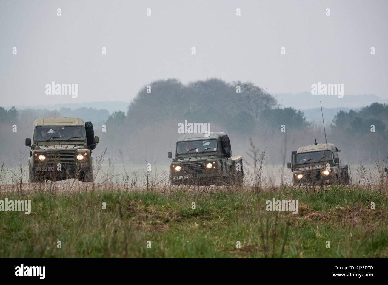 a small convoy British Army Land Rover Defender Wolf medium utility ...