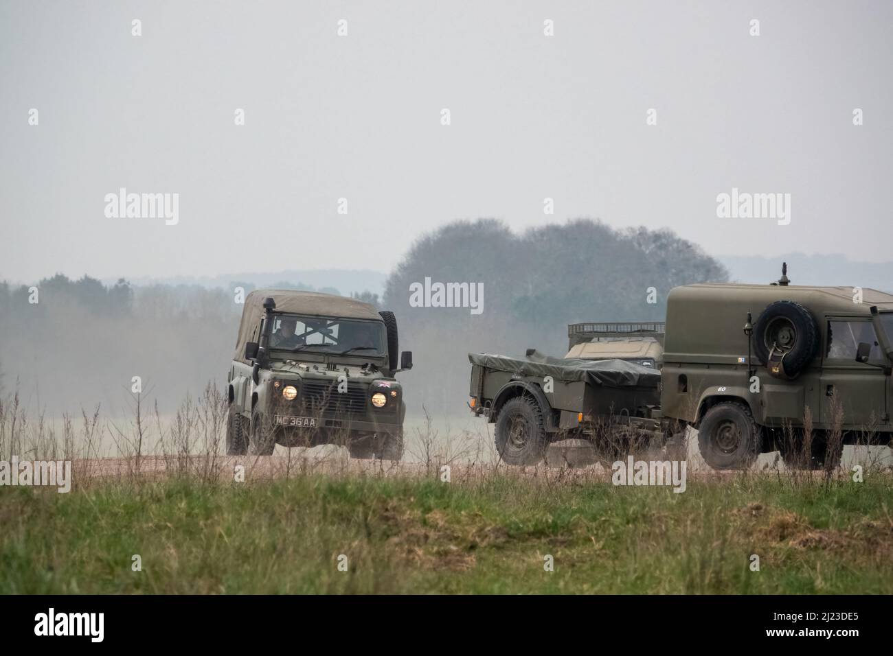 a small convoy British Army Land Rover Defender Wolf medium utility ...