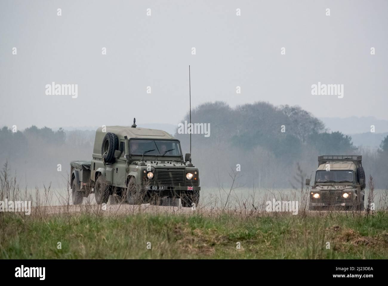 a small convoy British Army Land Rover Defender Wolf medium utility ...