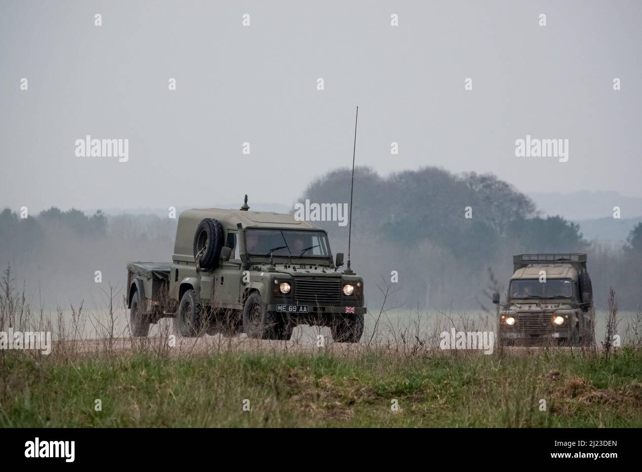 a small convoy British Army Land Rover Defender Wolf medium utility ...