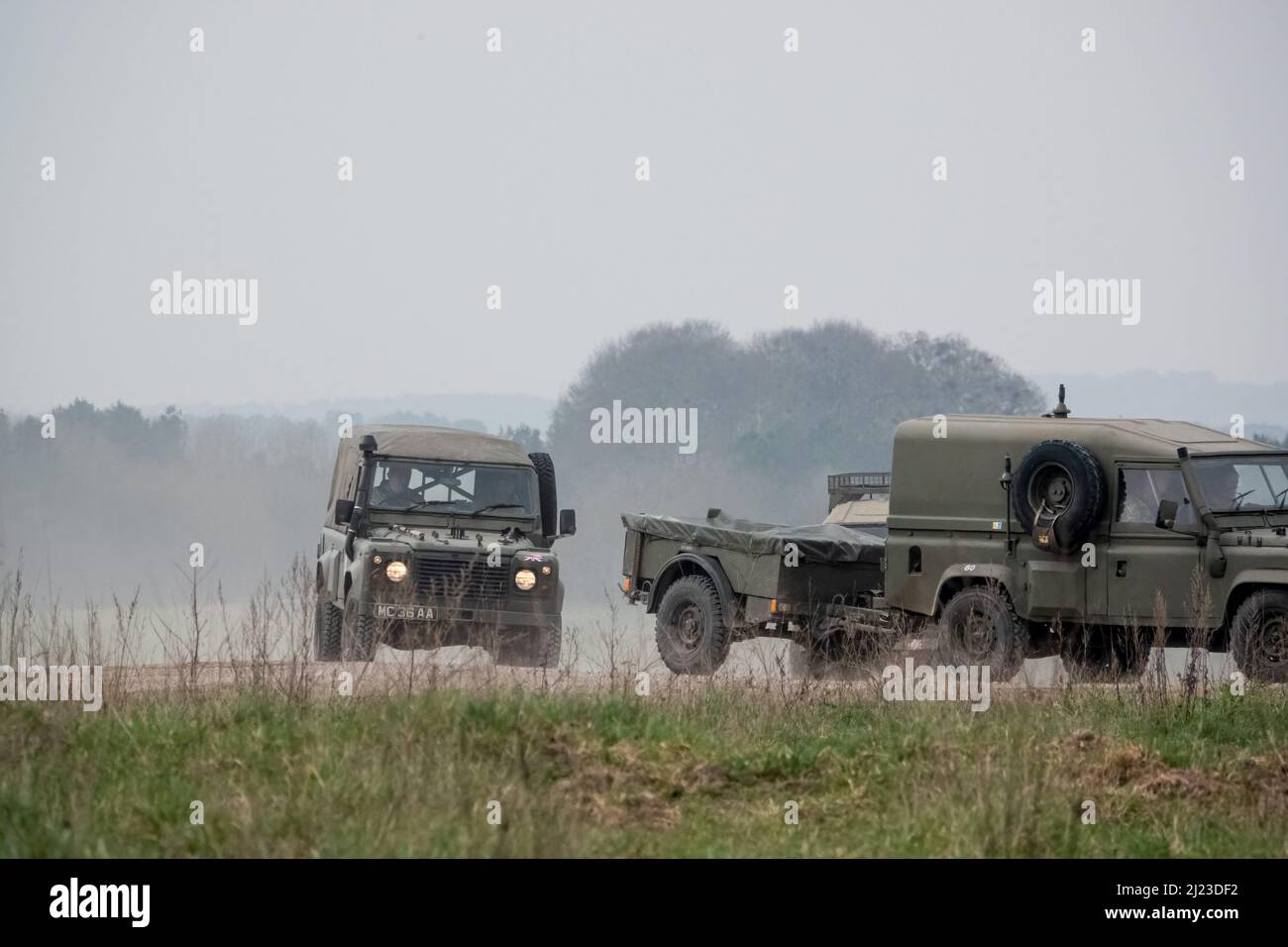 a small convoy British Army Land Rover Defender Wolf medium utility ...