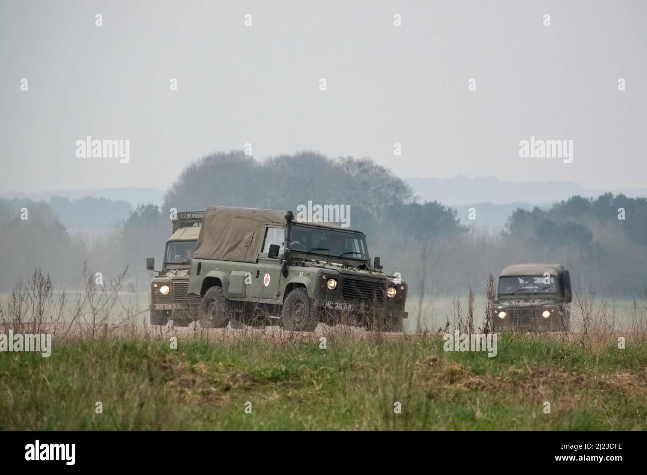 a small convoy British Army Land Rover Defender Wolf medium utility ...
