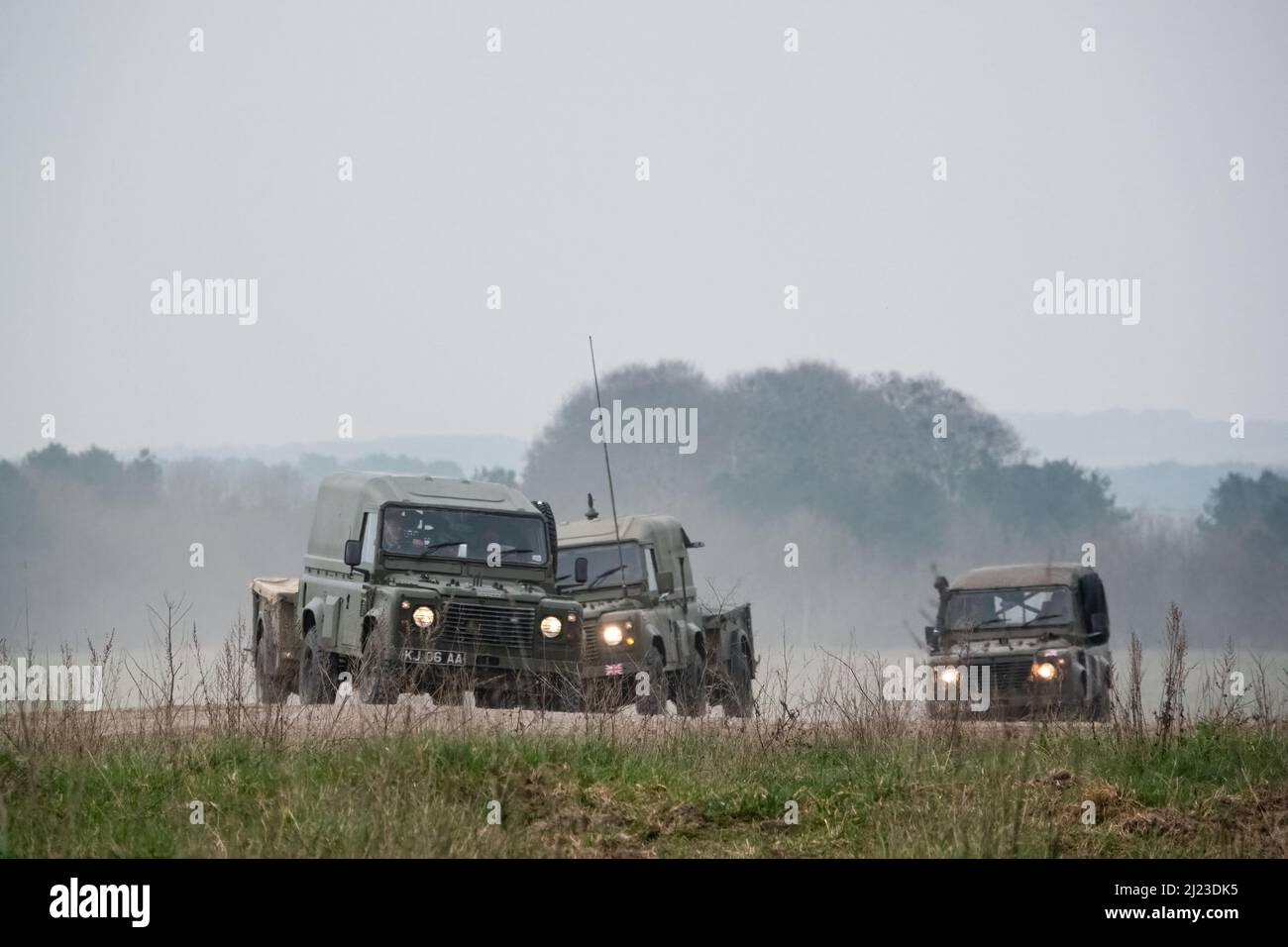 a small convoy British Army Land Rover Defender Wolf medium utility ...