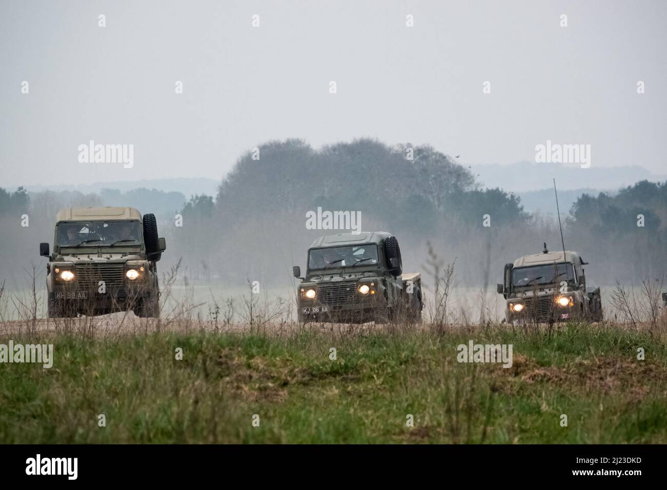 a small convoy British Army Land Rover Defender Wolf medium utility ...