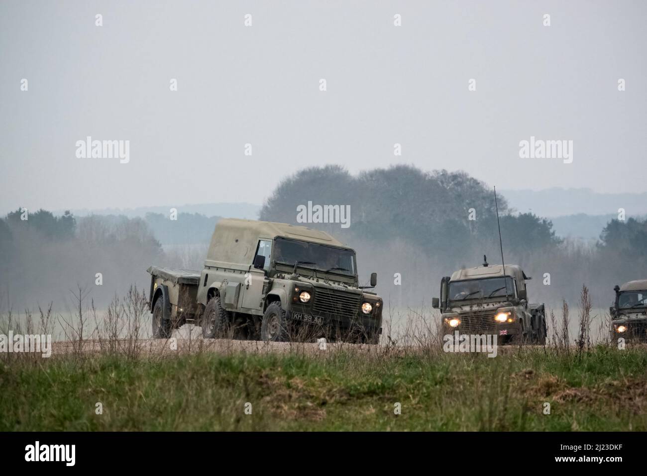 a small convoy British Army Land Rover Defender Wolf medium utility ...