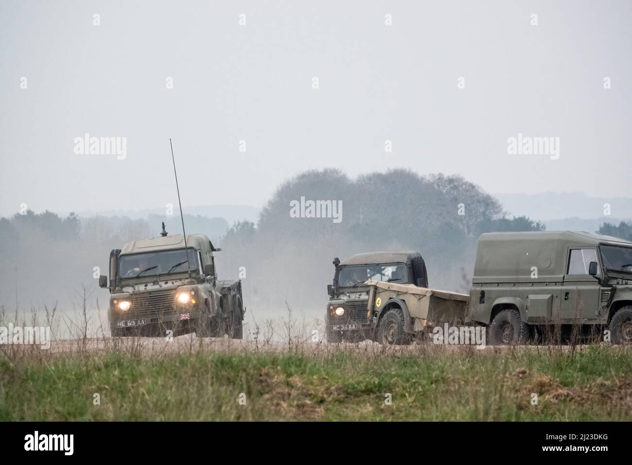 a small convoy British Army Land Rover Defender Wolf medium utility ...